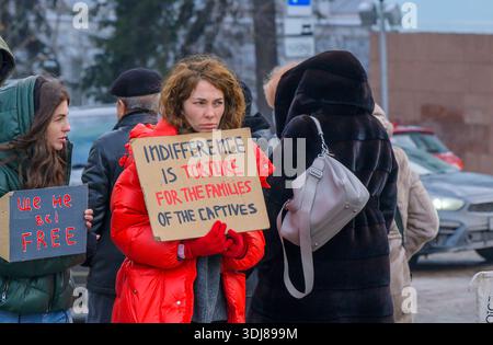 Kyiv, Ukraine - 25th January,2026: Young woman holding red placard ...