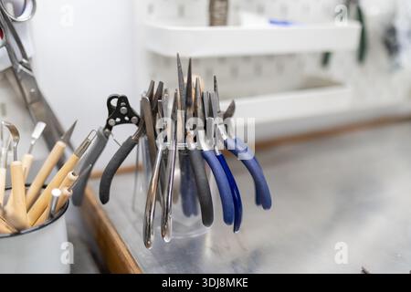 Artisan workshop displaying hand tools, saws, and clamps for carpentry ...
