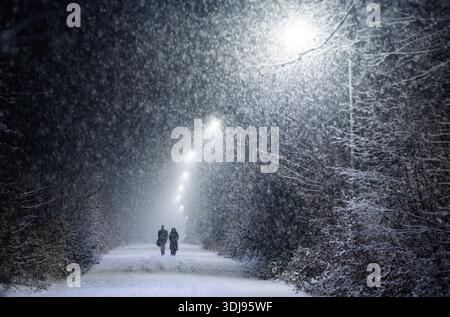 Stuttgart, Germany. 25th Jan, 2026. Cars driving on a snow-covered road ...