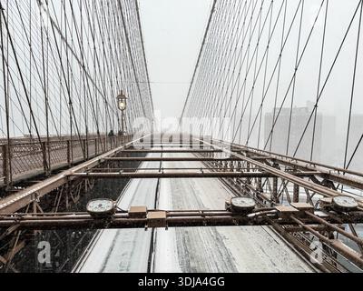 Brooklyn Bridge is seen covered with snow during a snowstorm in New ...