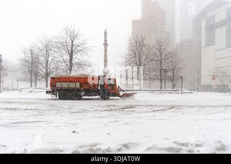 Sanitation Department truck plows snow on Brooklyn Bridge roadway ...