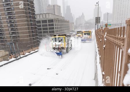 Sanitation Department truck plows snow Sunday's blizzard around ...