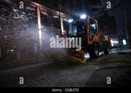 Berlin, Germany. 26th Jan, 2026. A gritting truck drives through the ...