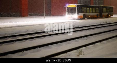 Laatzen, Germany. 26th Jan, 2026. A man walks to a light rail station ...