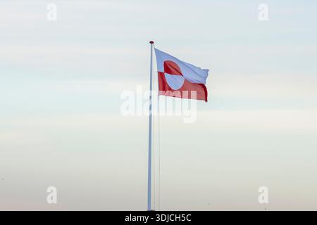 Nuuk, Greenland 20260125. A Greenlandic flag flutters in the wind in ...