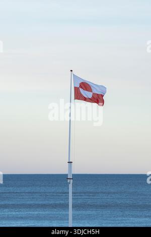 Nuuk, Greenland 20260125. A Greenlandic flag flutters in the wind in ...