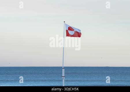 Nuuk, Greenland 20260125. A Greenlandic flag flutters in the wind in ...