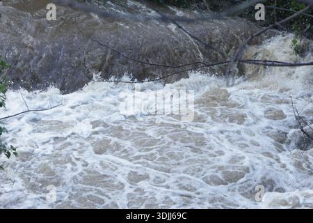 Dublin, Ireland - 27th January 2026: Fast flowing water in a river in ...