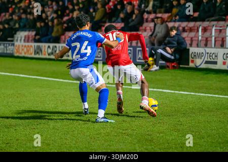 Dilan Markanday of Chesterfield FC tackles Kelly Nmai of Salford City ...