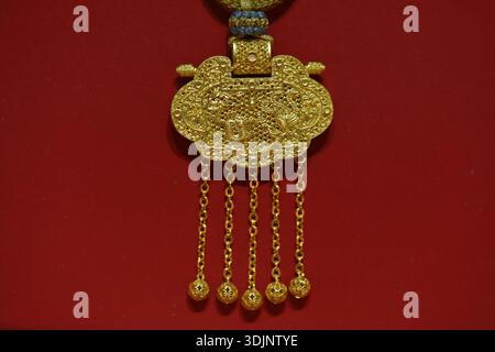 Gold jewelry being photographed in a gold shop in Fuyang City, Anhui ...