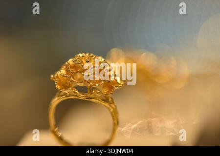 Gold jewelry being photographed in a gold shop in Fuyang City, Anhui ...