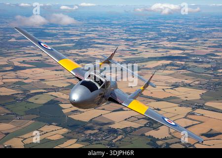 This image shows a de Havilland Vampire jet aircraft severely damaged ...
