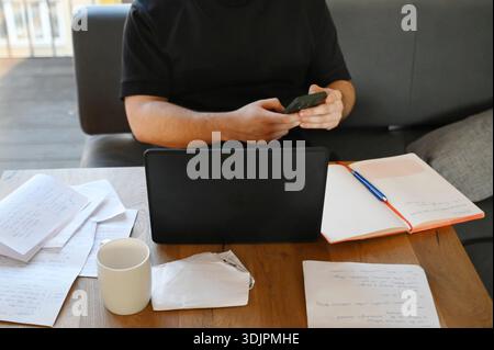 ILLUSTRATION - 22 January 2026, Berlin: A person is working at a desk ...