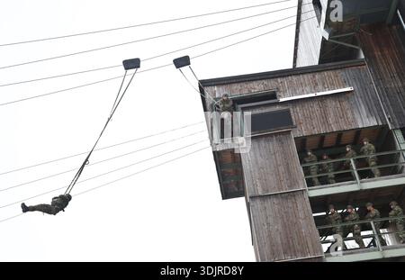 28 January 2026, Bavaria, Altenstadt: Parachutist trainees practise on ...