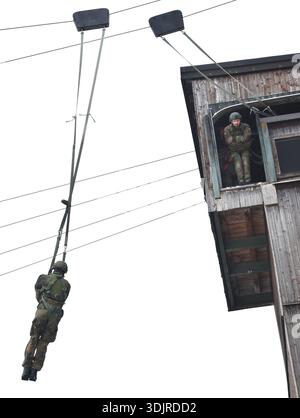 28 January 2026, Bavaria, Altenstadt: Parachutist trainees practise on ...