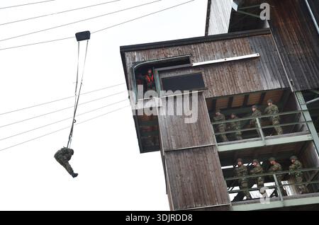 28 January 2026, Bavaria, Altenstadt: Parachutist trainees practise on ...