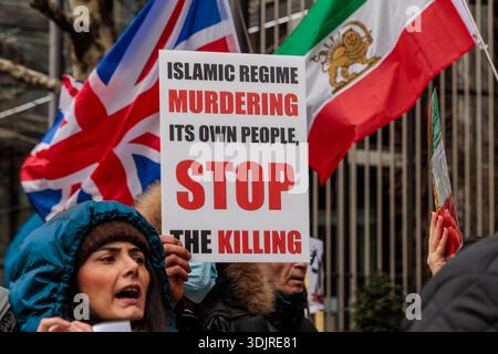 Protesters march in support of regime change in Iran during a ...