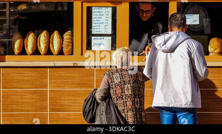 Locals purchasing fresh bread Locals purchasing fresh bread at a ...
