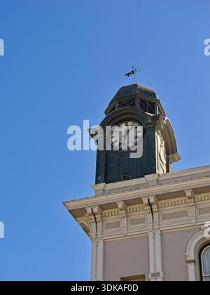 Clock in a small tower with copper roof Stock Photo - Alamy