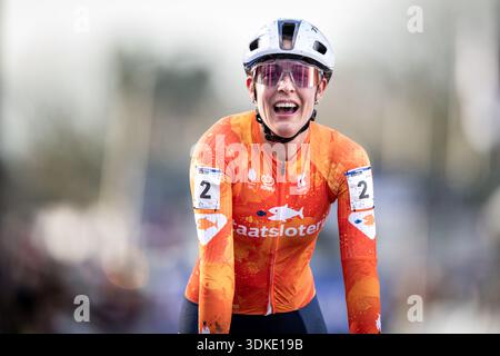 Dutch Lucinda Brand celebrates as she crosses the finish line carrying ...