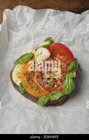 Baking paper with bread and knife on white wooden background Stock ...