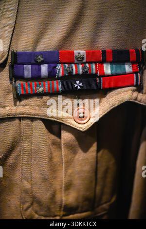 Service medals on the uniform of a member of the military during a ...