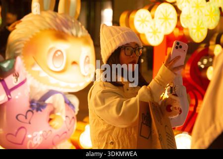 A Labubu illuminates in front of Shanghai BFC during the opening of the ...