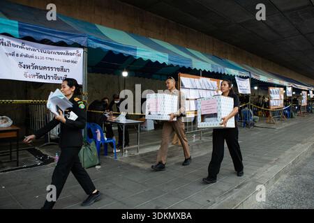 Election officials collect ballot papers during the early voting at ...