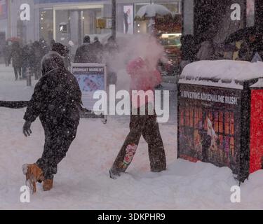 People engage in a snowball fight as U.S. flags along the base of the ...