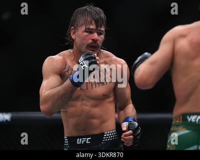 Diego Lopes (R) of Brazil seen in action with Alexander Volkanovski (L ...