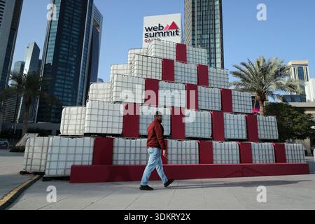 A man walks past a model of Web Summit 2026, the world's largest ...