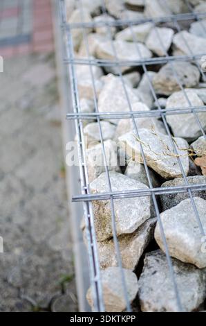 Stone rock wall landscaping fence Stock Photo - Alamy