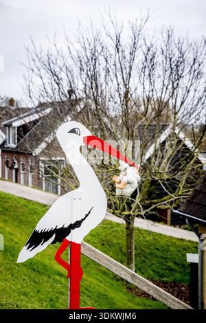 STREEFKERK - A stork with a baby in its mouth. ROBIN UTRECHT /ANP ...