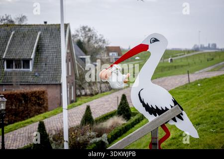 STREEFKERK - A stork with a baby in its mouth. ROBIN UTRECHT /ANP ...