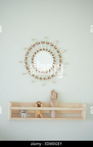 Wooden hand with mirror on light background Stock Photo - Alamy