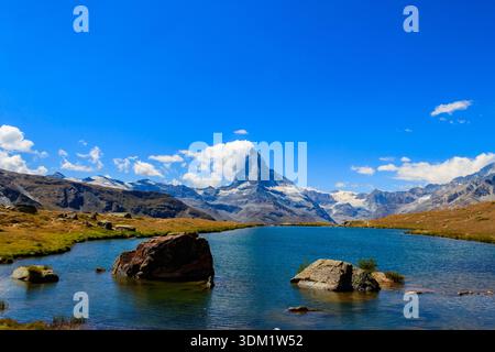 View of Stelli Lake (Stellisee) and Matterhorn mountain at summer in ...