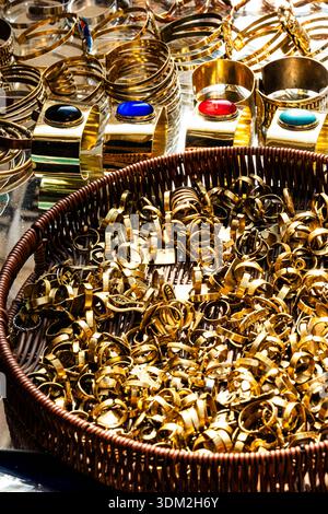 Gold bracelets and jewelry displayed at a market stall Stock Photo - Alamy