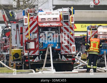 05 February 2026, Hesse, Darmstadt-Wixhausen: Firefighters fight a fire ...