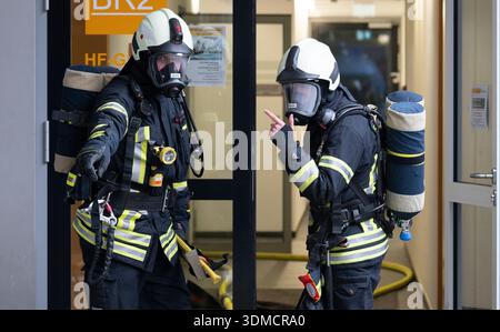 05 February 2026, Hesse, Darmstadt-Wixhausen: Firefighters fight a fire ...