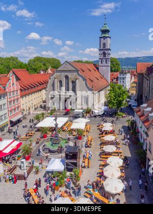 Germany, Lindau old town aerial above treetops with Austrian Alps and ...