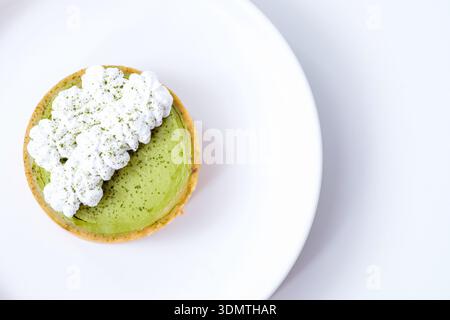 Matcha cheese tart on a white plate Stock Photo - Alamy