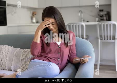 Woman feeling stressed and frustrated while sitting in her car ...