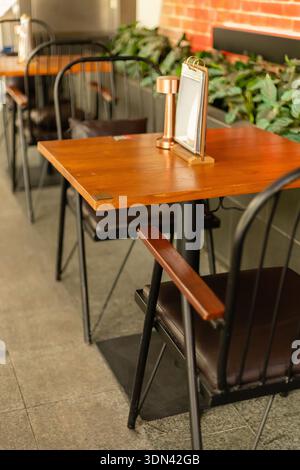 Plants sit on a wooden table in a bright room Stock Photo - Alamy