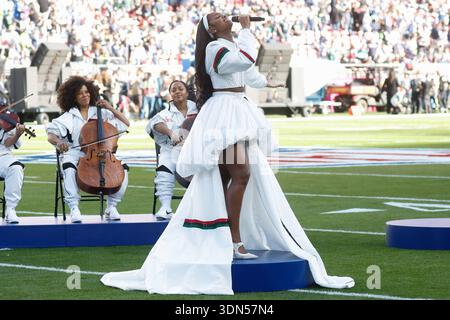 Coco Jones performs before the NFL Super Bowl 60 football game between ...