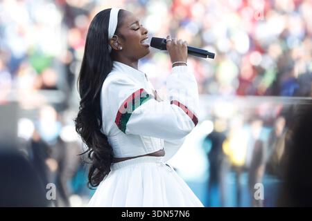 Coco Jones performs before the NFL Super Bowl 60 football game between ...