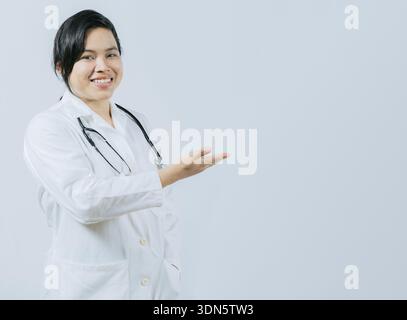 Young Asian female doctor presenting cosmetic product during virtual ...
