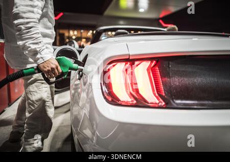 A person fills up their car at a gas station in Montreal on Thursday ...