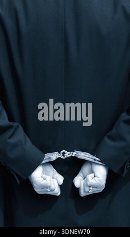 Police steel handcuffs in back jeans pocket close up Stock Photo - Alamy