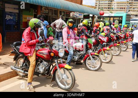 Motorcycle taxi riders wait to transport passengers in Bunia, Congo ...