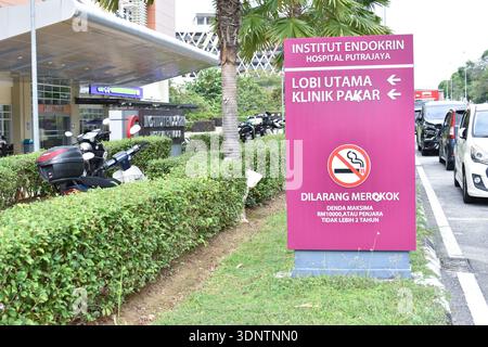 The exterior of a medical facility with a directional sign and a ...